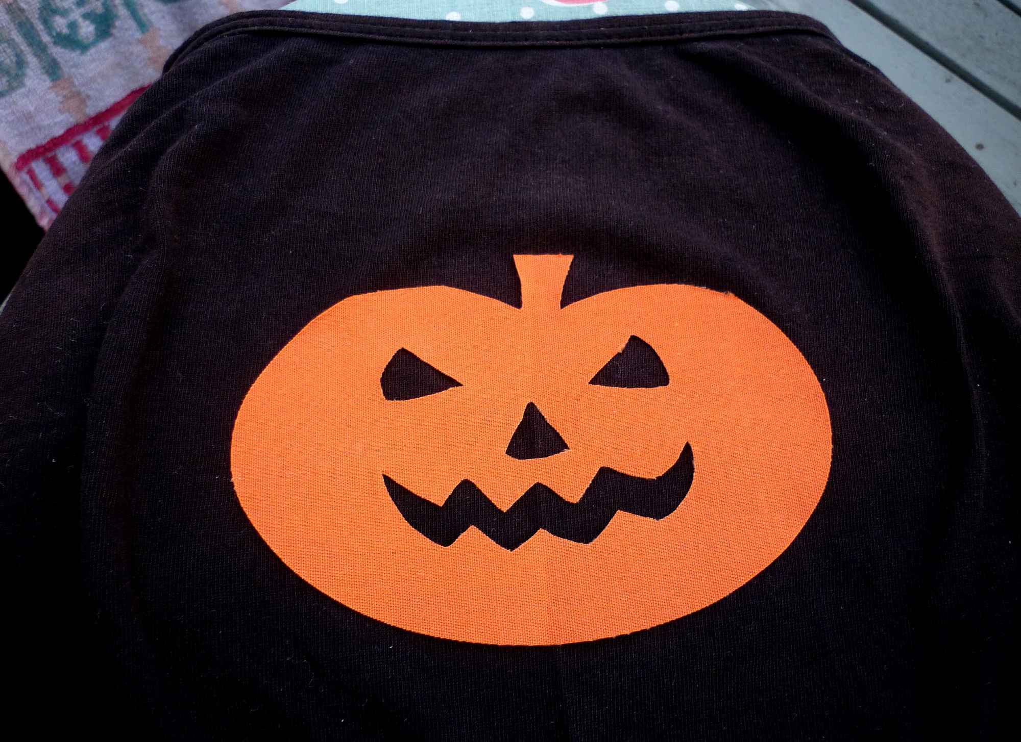 Make your own pumpkin face motif top in minutes using an iron on patch ...